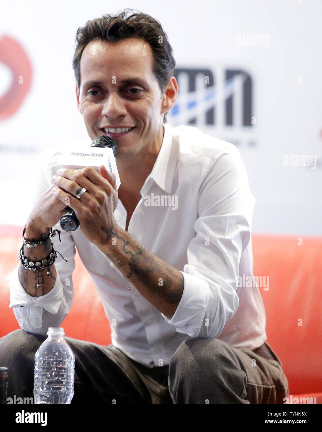 Marc Anthony speaks to attendees when he conducts a listening session ...