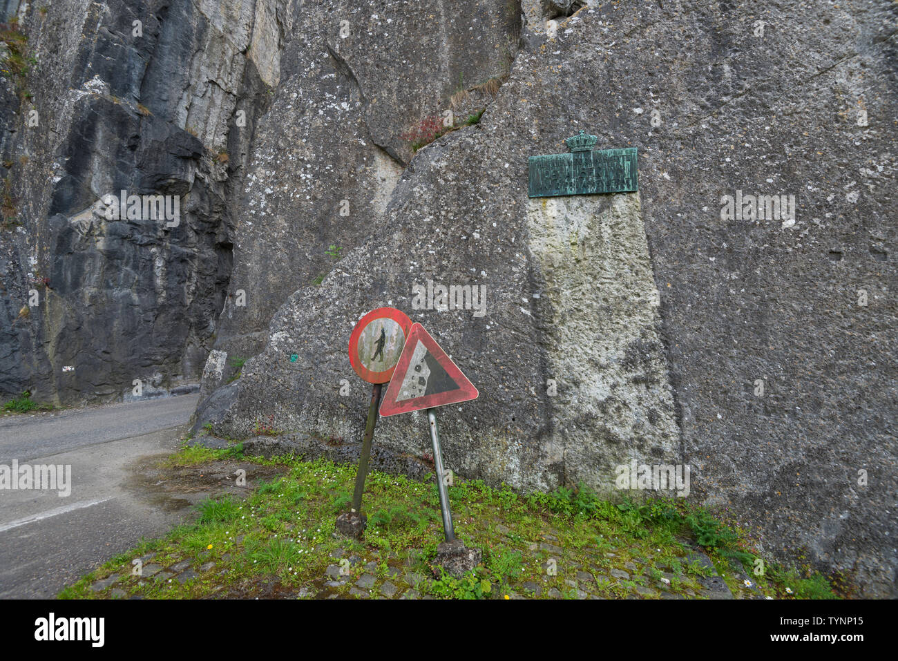 Warning signs next to the Bayard Rock in Dinant, Belgium Stock Photo ...
