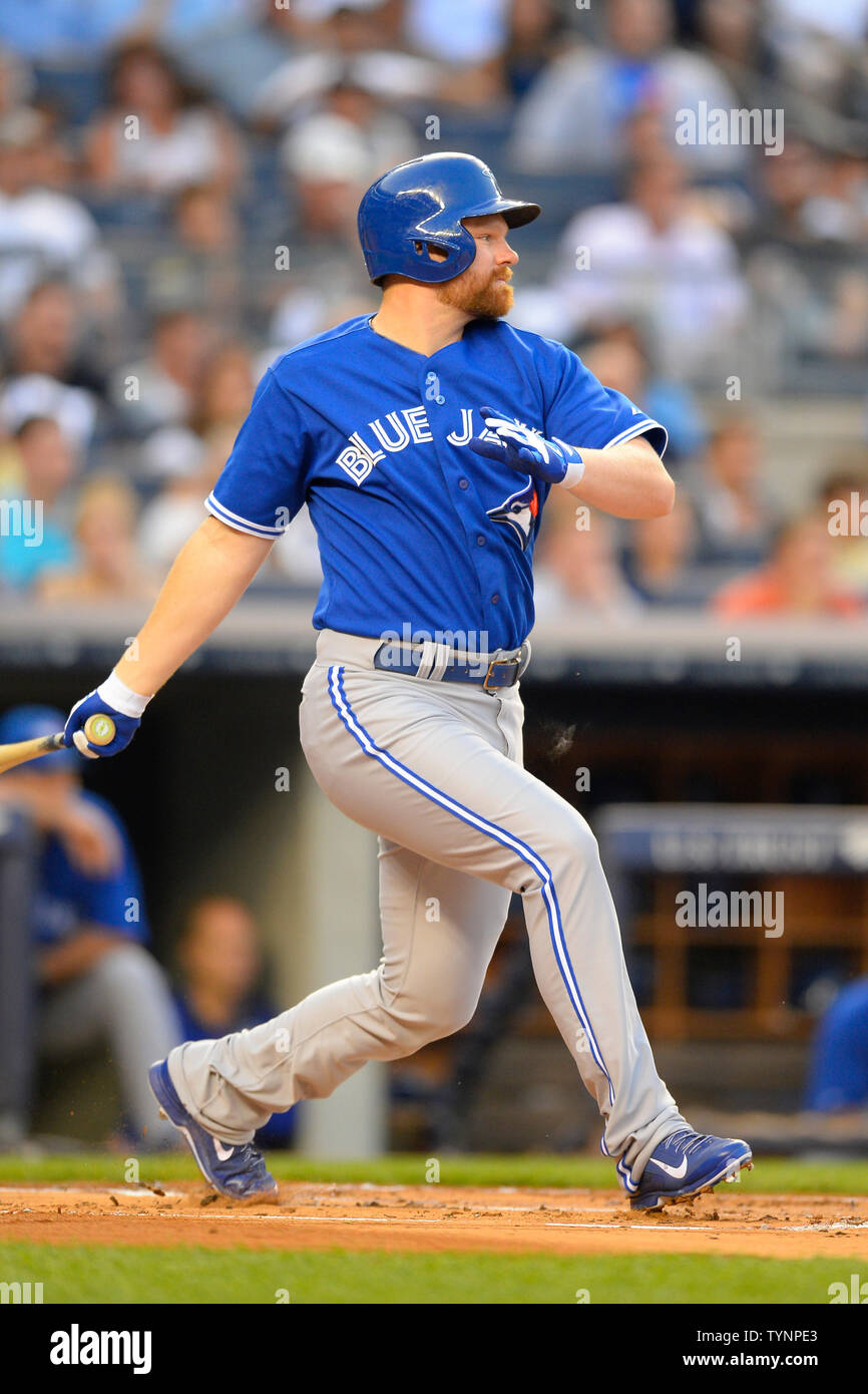 Toronto Blue Jays first baseman Adam Lind (26) singles to left against ...