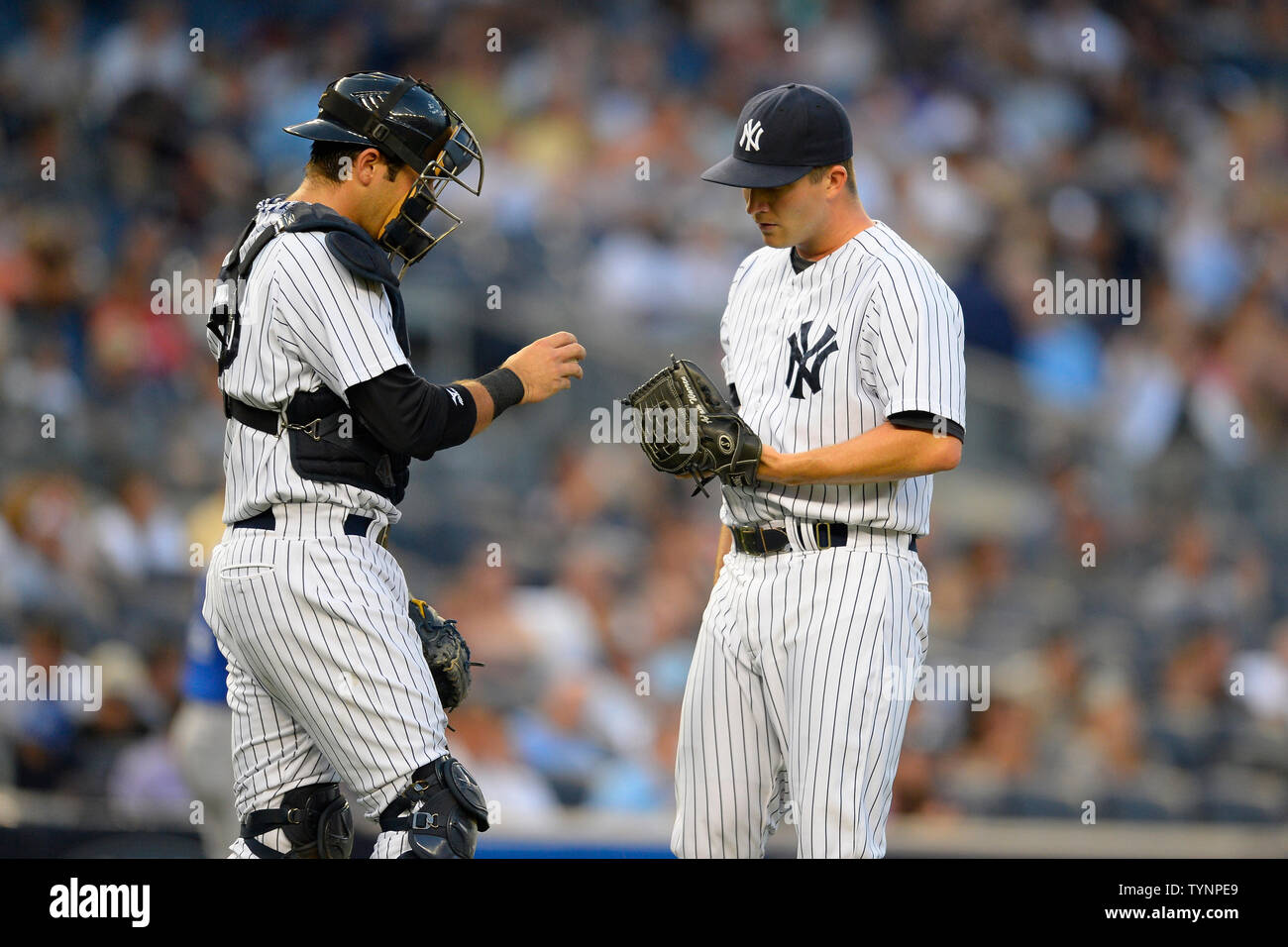 New York Yankees catcher Austin Romine (53) meets with Yankees relief ...