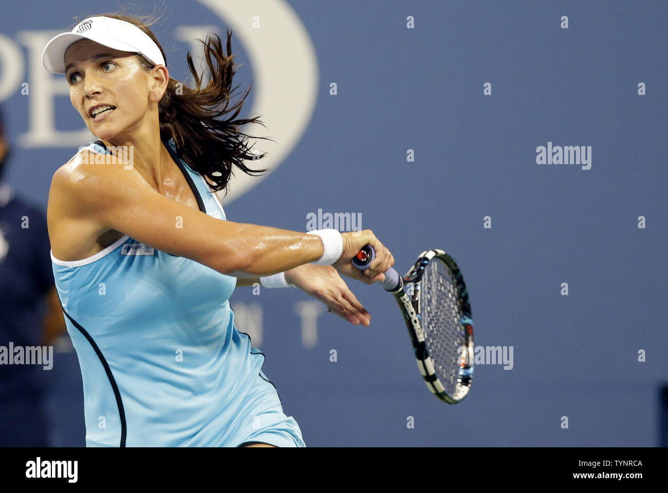 Chanelle Scheepers of South Africa returns a ball in her straight sets ...