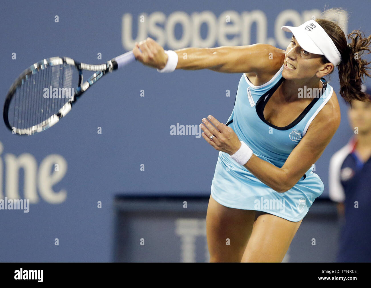 Chanelle Scheepers of South Africa serves in her straight sets second ...