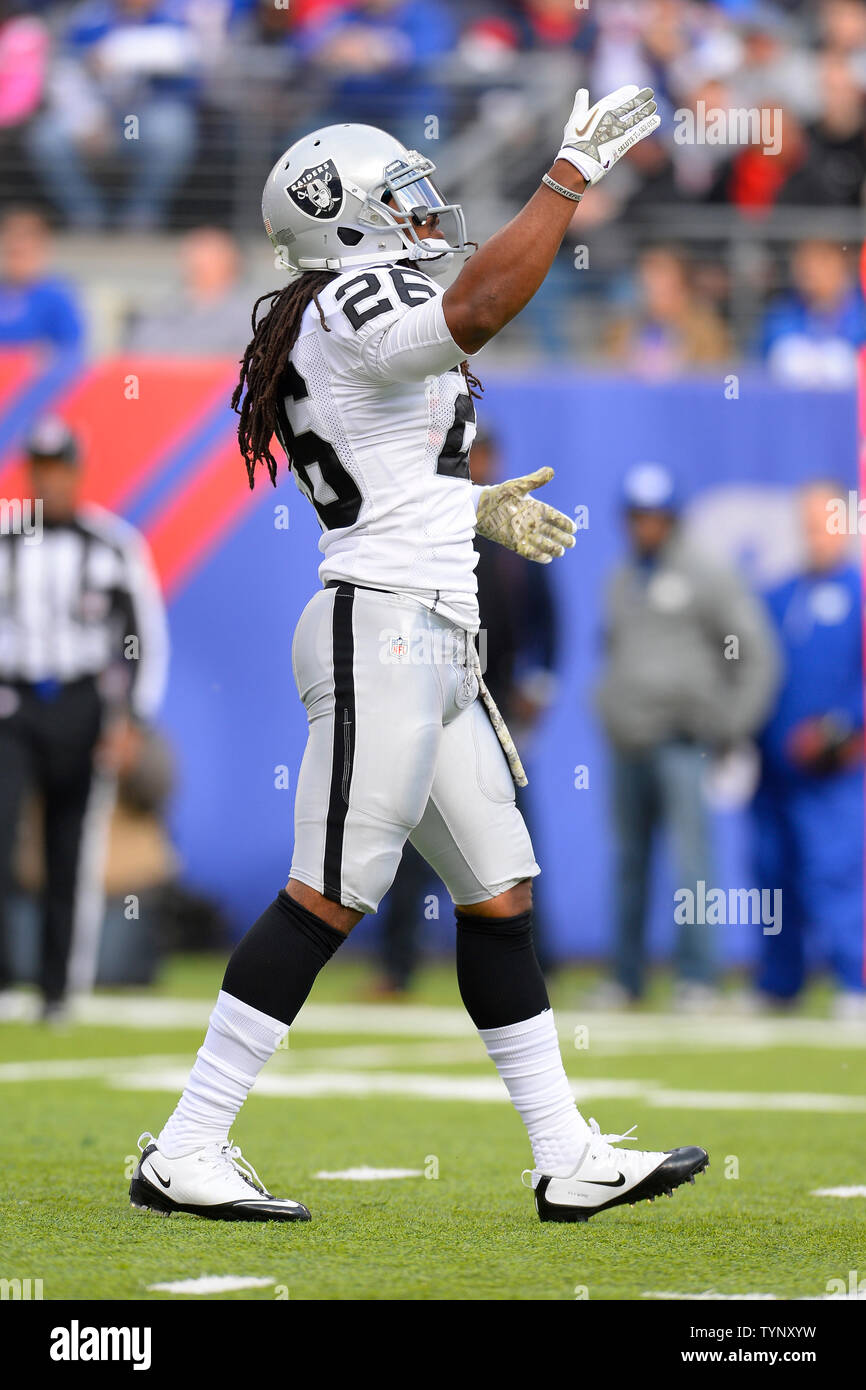 Oakland Raiders free safety Usama Young (26) reacts with fans after ...