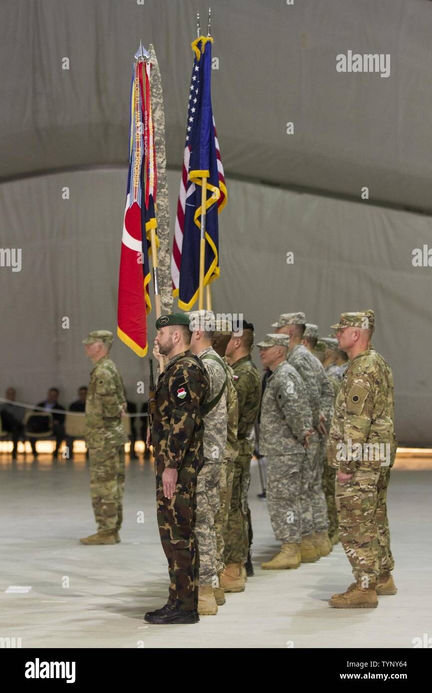 A color guard presents the colors for the United States, NATO, the 37th ...