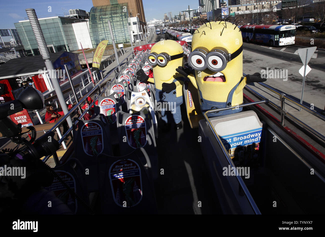 Minions from the film Despicable Me 2 stand on the second deck of the ...