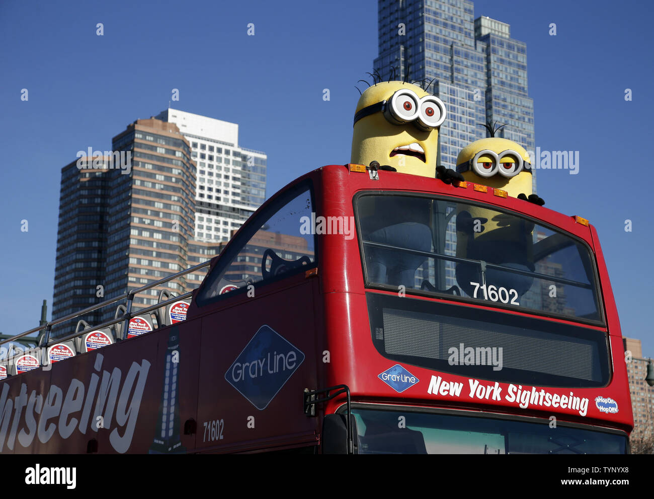 Minions from the film Despicable Me 2 stand on the second deck of the ...