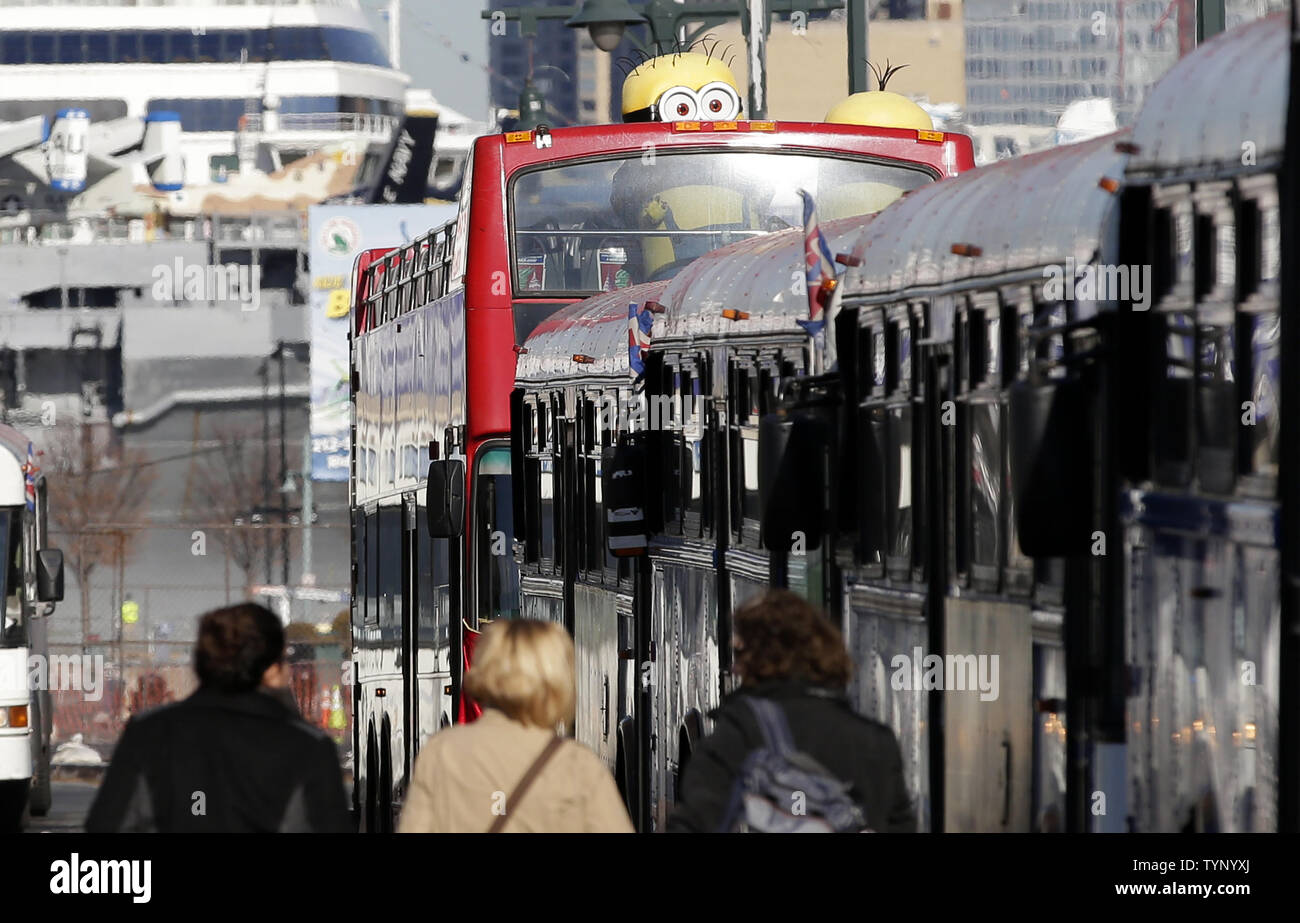 Minions from the film Despicable Me 2 ride on the Gray Line New York ...