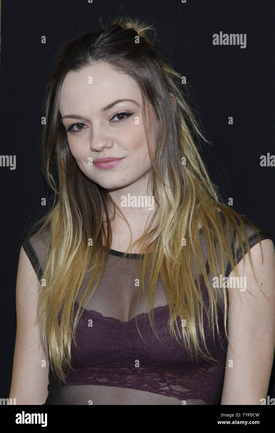Emily Meade arrives on the red carpet at the American Hustle premiere ...