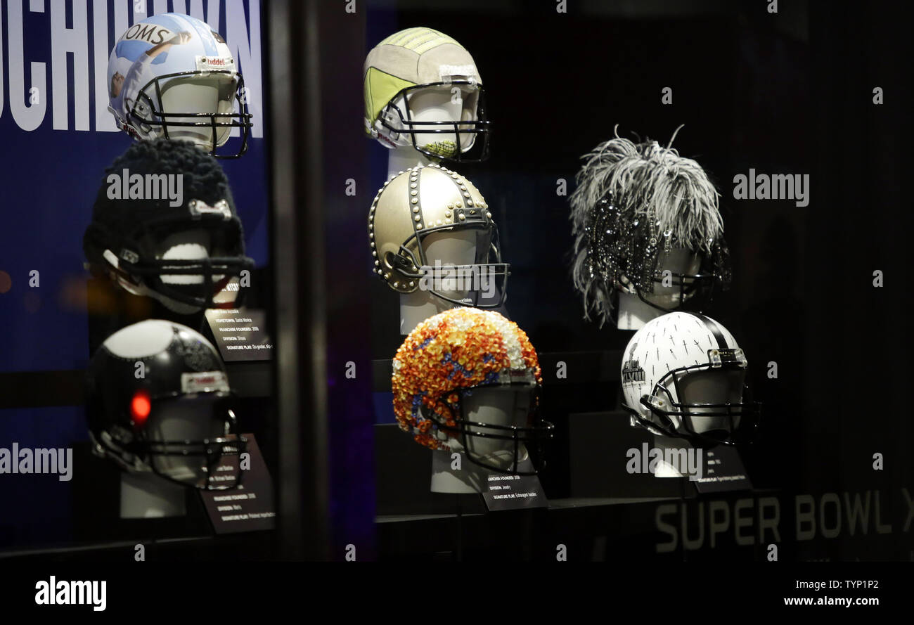 NFL helmets created by top designers sit on display in a Lexington ...