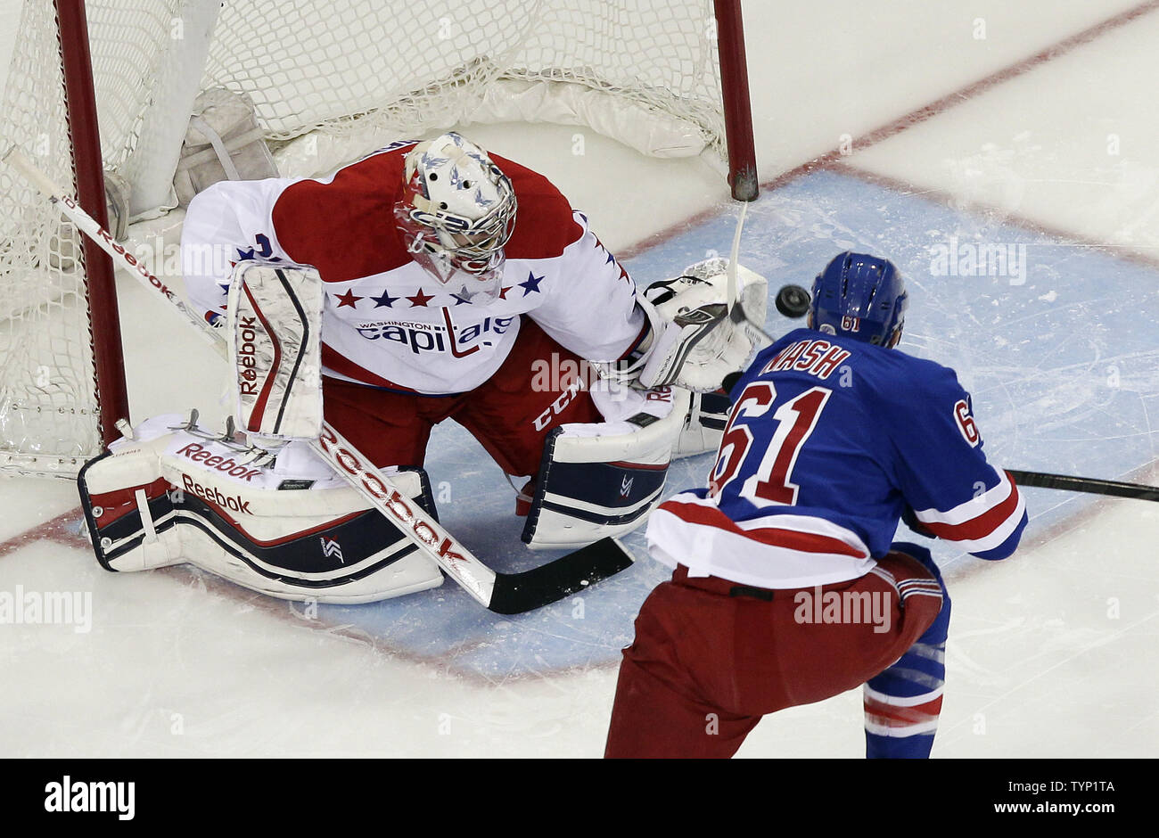 New York Rangers Rick Nash gets the puck past Washington Capitals ...