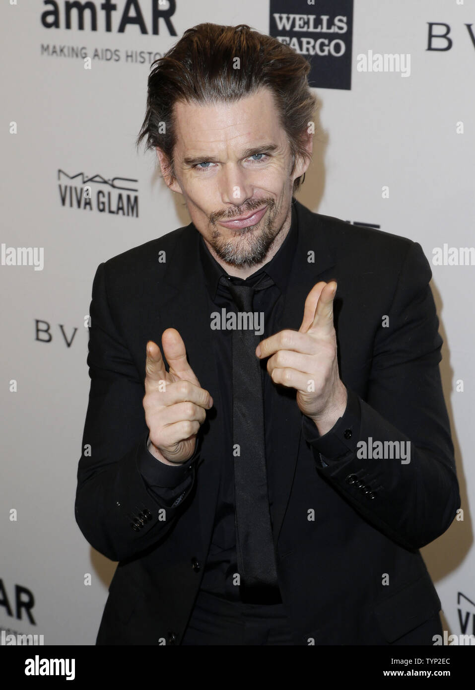 Ethan Hawke arrives on the red carpet at the amfAR New York Gala at ...