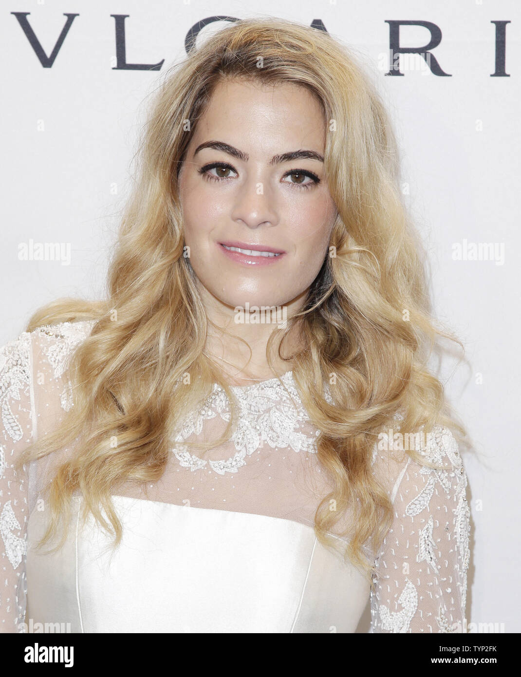 Chelsea Leland arrives on the red carpet at the amfAR New York Gala at ...
