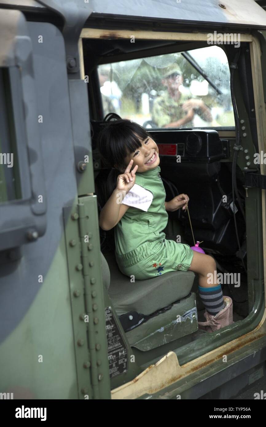 An Okinawa resident poses inside a Humvee Nov. 20, 2016 during the ...