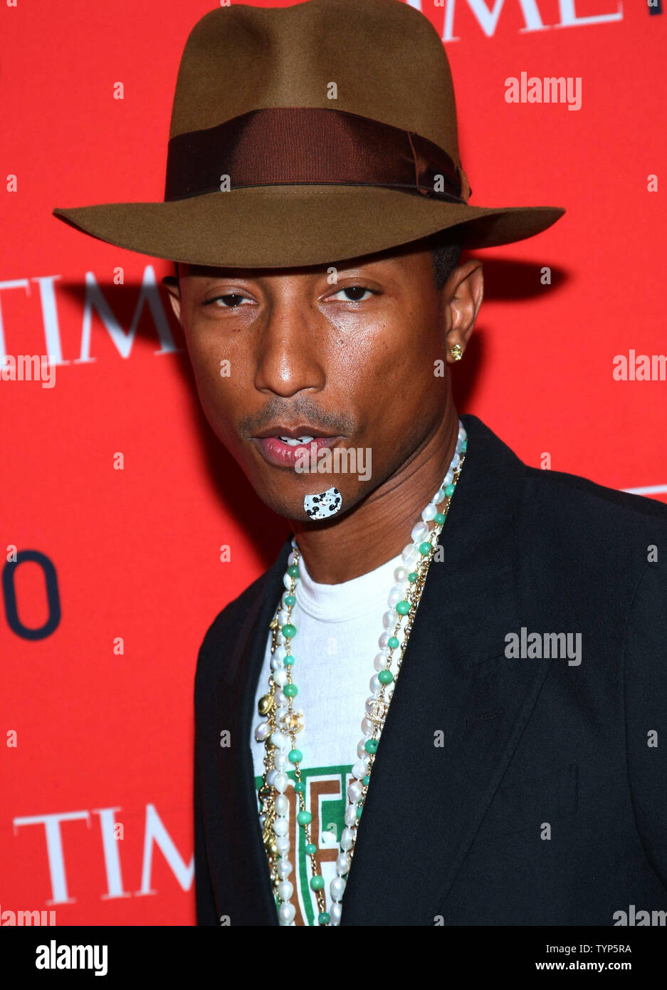 Pharrell Williams arrives on the red carpet at the TIME 100 Gala at ...