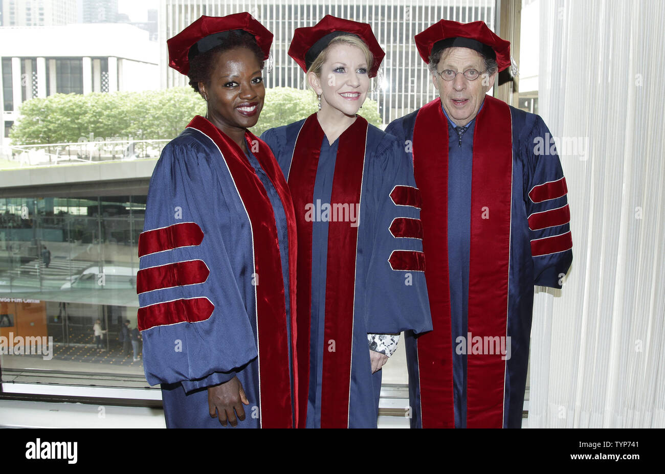 Philip Glass, Viola Davis and Joyce DiDonato stand in a cap and gown ...