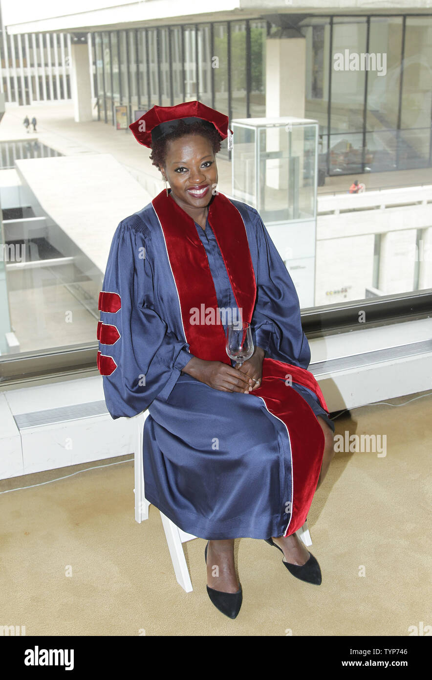 Actress Viola Davis sits in a cap and gown before receiving an honorary ...
