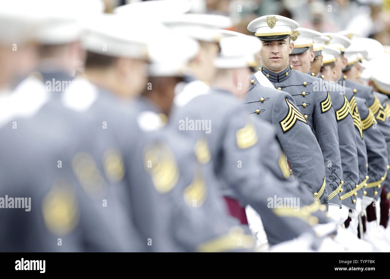 Cadets walk from the benches to receive their diplomas at the West ...