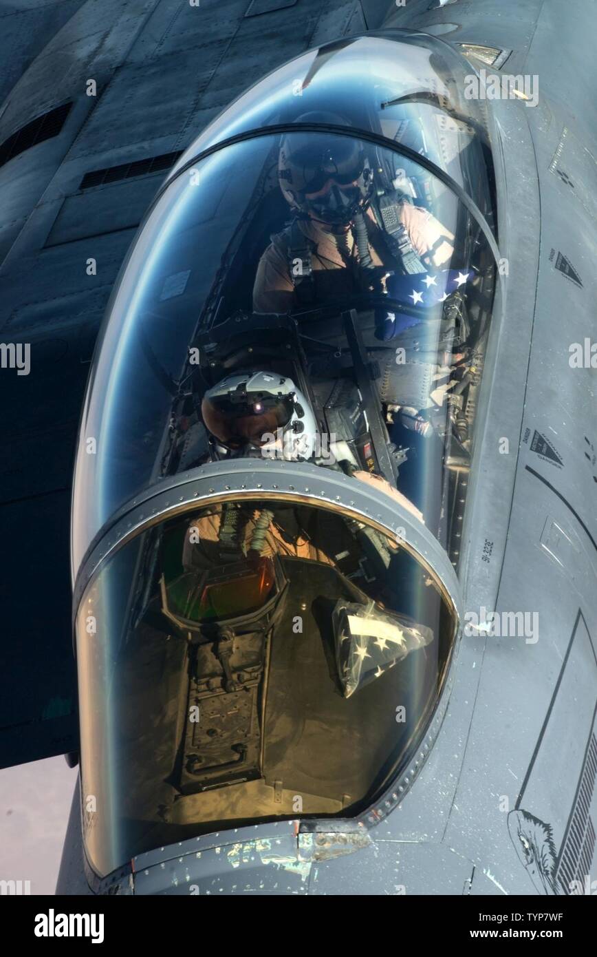 Two U.S. Air Force F-15E Strike Eagle pilots refuel while flying near ...