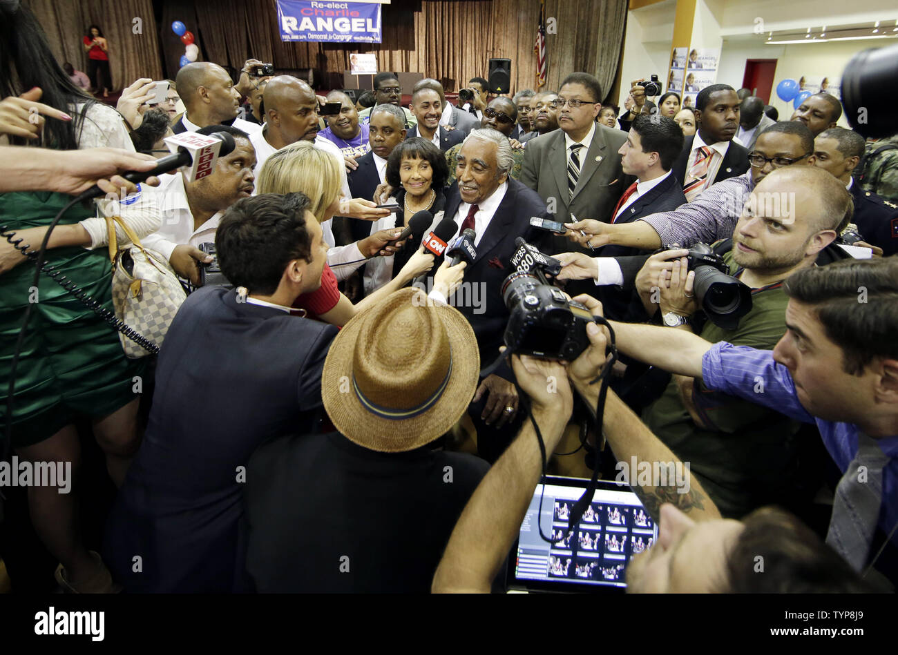 Charlie Rangel stands with wife Alma surrounded by members of the media ...