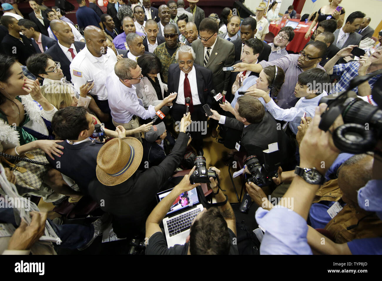 Charlie Rangel stands with wife Alma surrounded by members of the media ...