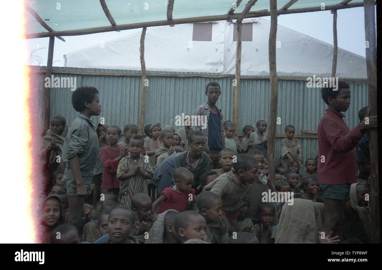 CHILDREN GATHERED TOGETHER SITTING AND STANDING Stock Photo - Alamy