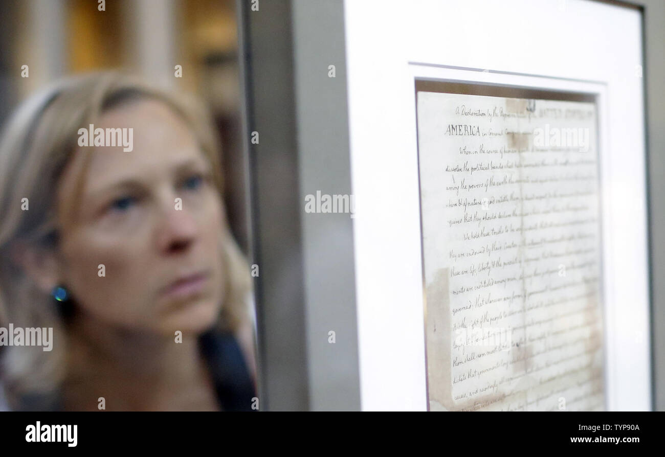A woman looks at a rare historic copy of the Declaration of ...