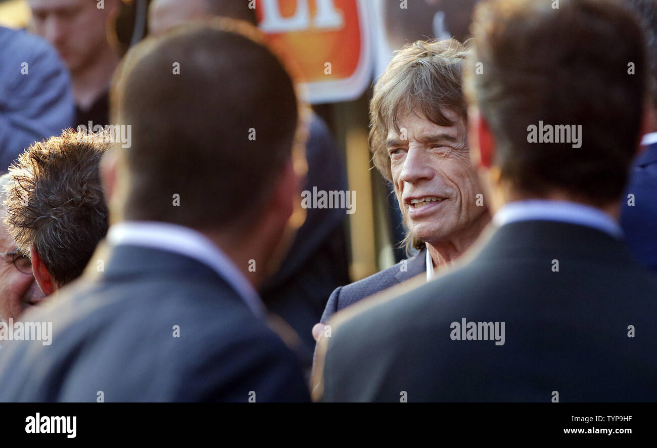 Mick Jagger arrives on the red carpet at the world premiere of 'Get On ...