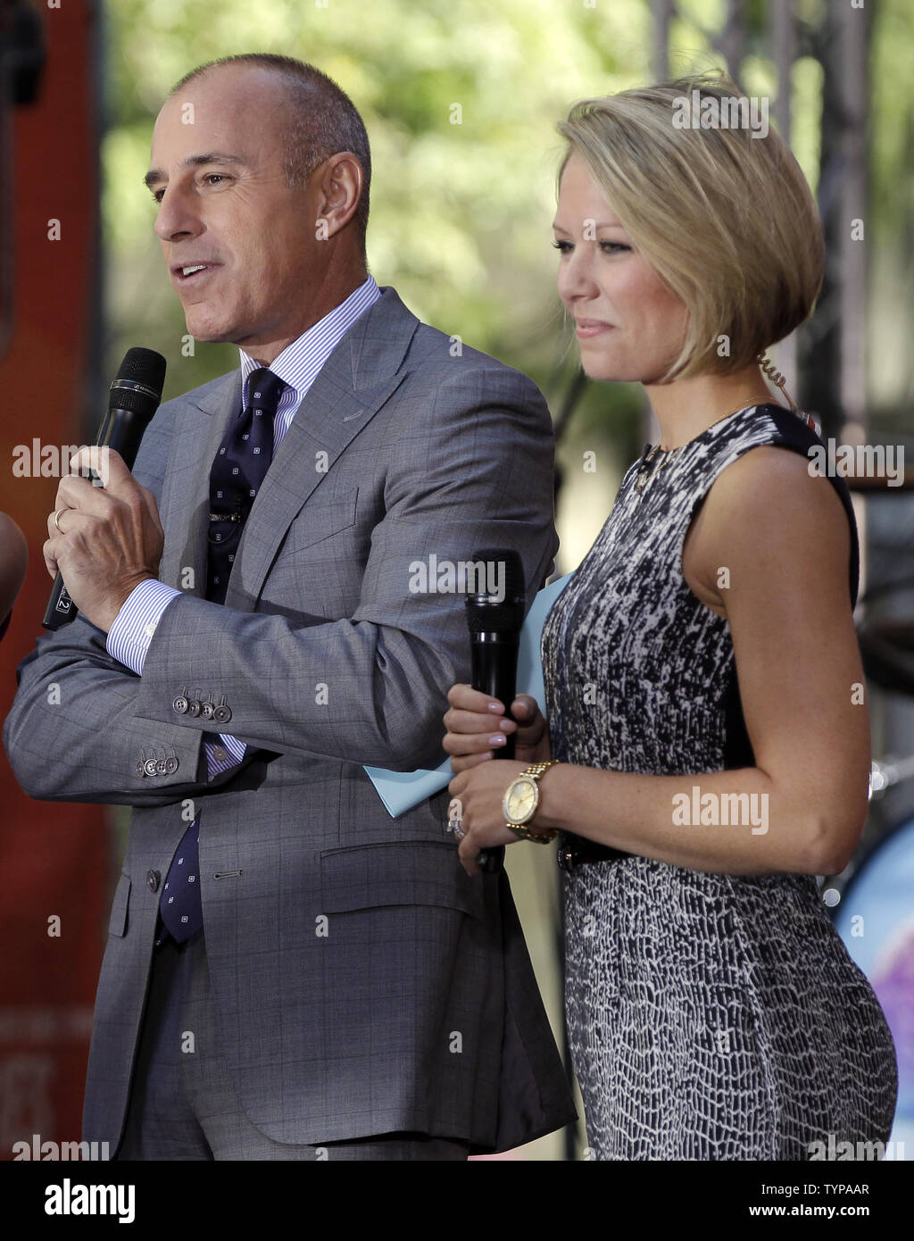 Matt Lauer and Dylan Dreyer stand on the stage when Neon Trees performs ...