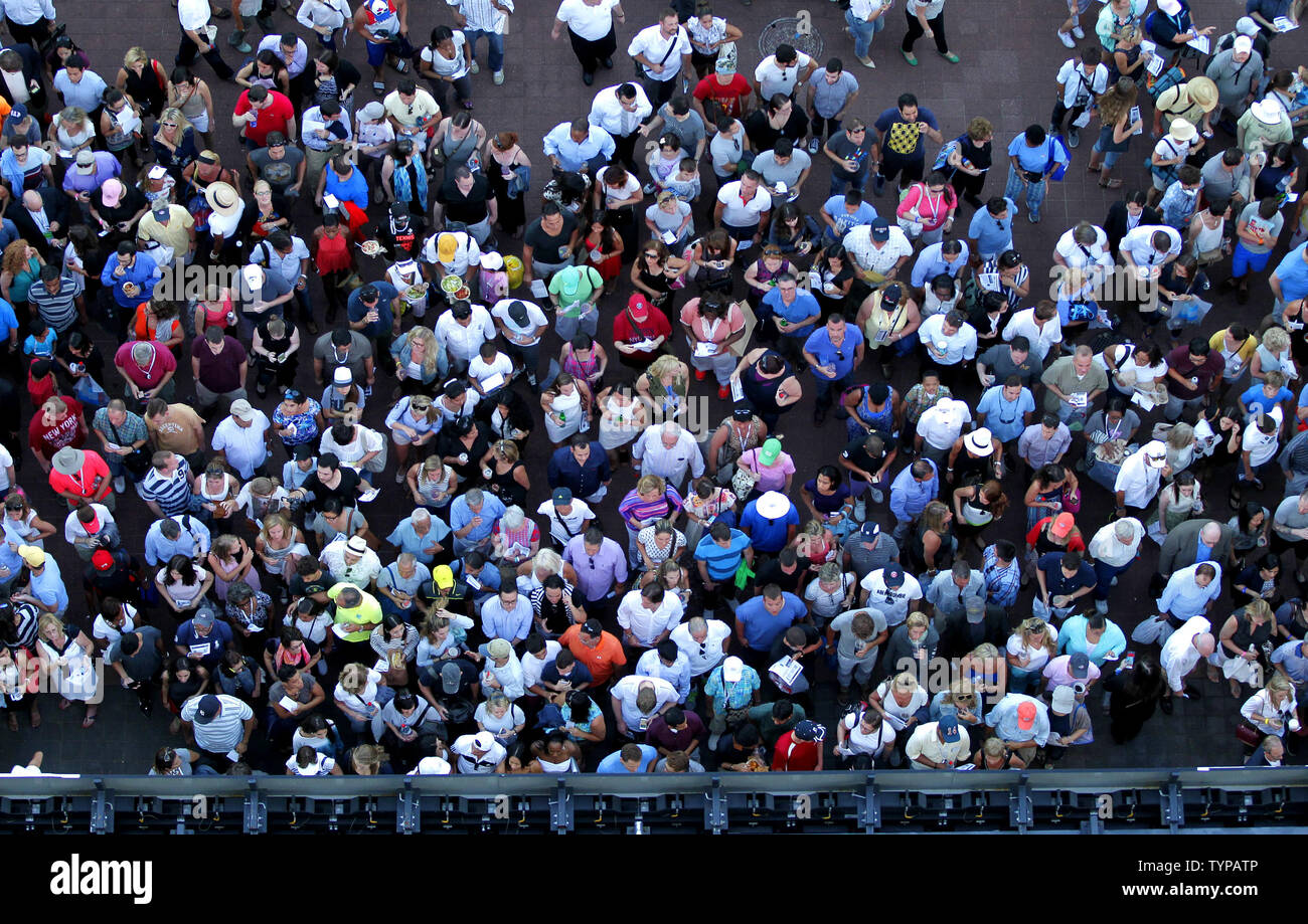Fans enter Arthur Ashe Stadium for opening night ceremonies at the US ...