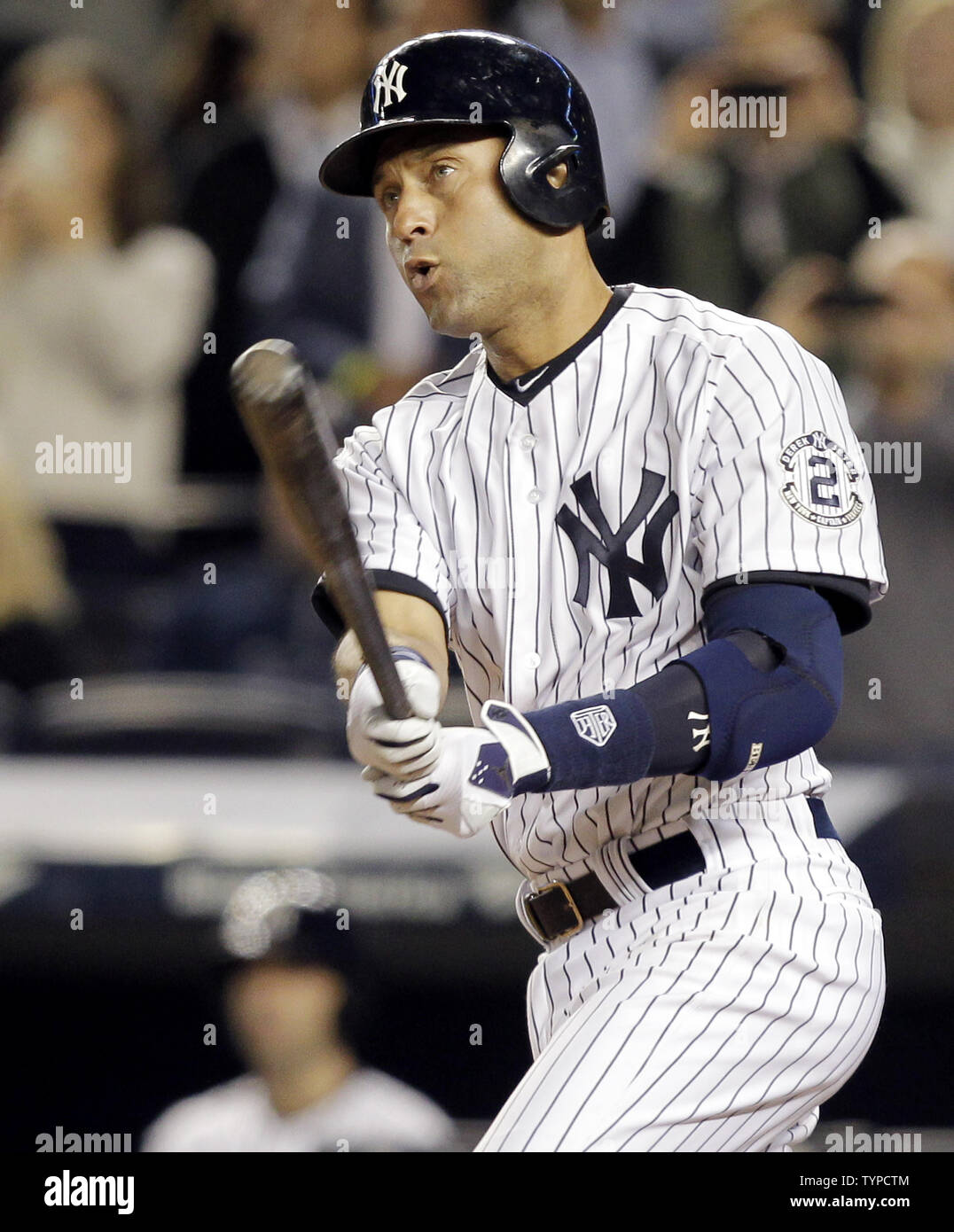 New York Yankees Derek Jeter drives in 2 runs with a double in the ...