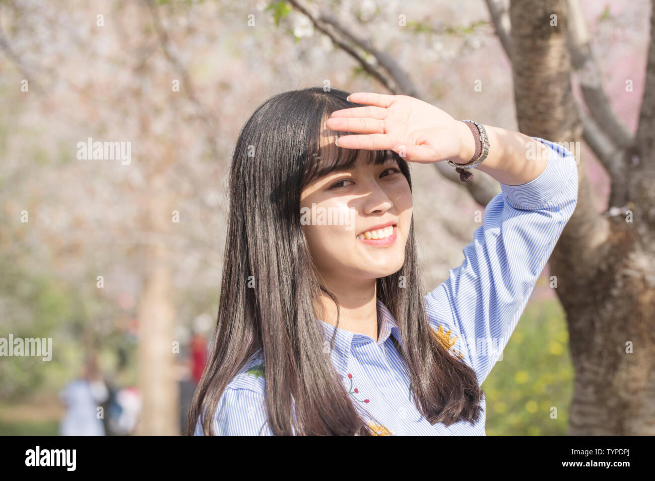 Beautiful girl looking at the camera Stock Photo - Alamy