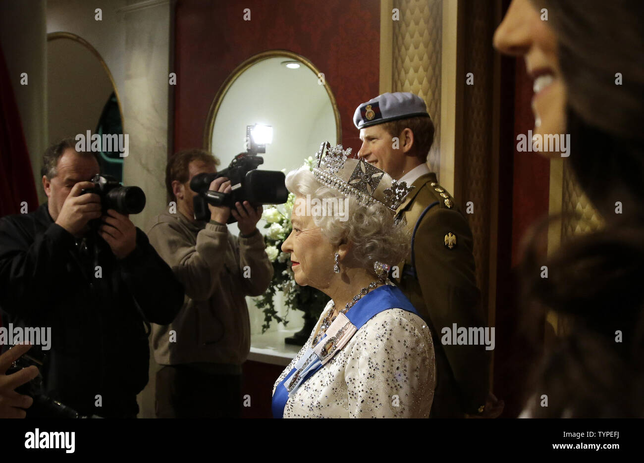 Wax figures of Prince Harry, Queen Elizabeth, Prince William and ...