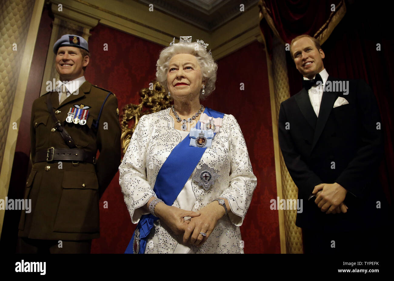 Wax figures of Prince Harry, Queen Elizabeth and Prince William seen ...