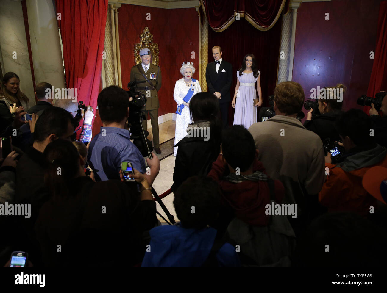 Wax figures of Prince Harry, Queen Elizabeth, Prince William and ...