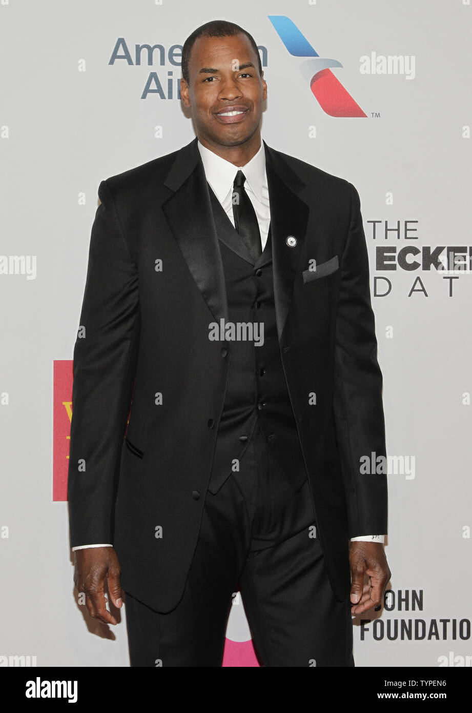 Jason Collins arrives on the red carpet at the Elton John AIDS ...