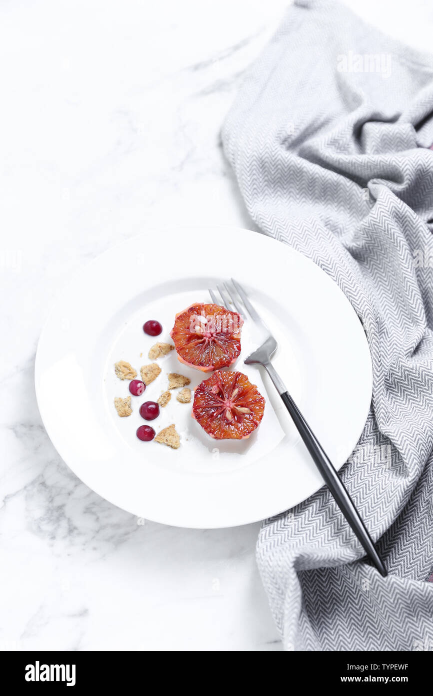 One person eating yogurt cereal fruit breakfast on white background ...