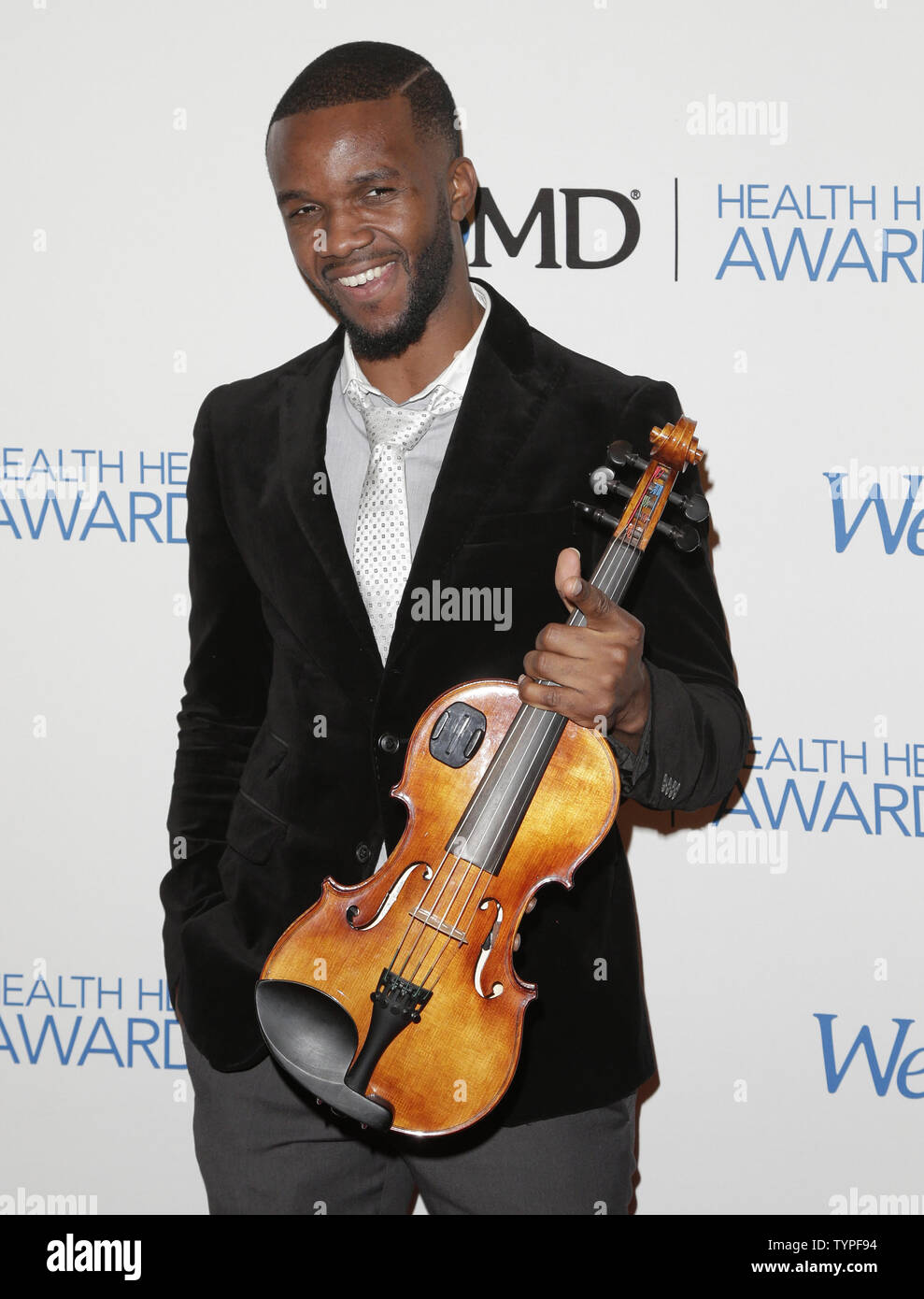 Lee England Jr. arrives on the red carpet at the 2014 Health Hero ...