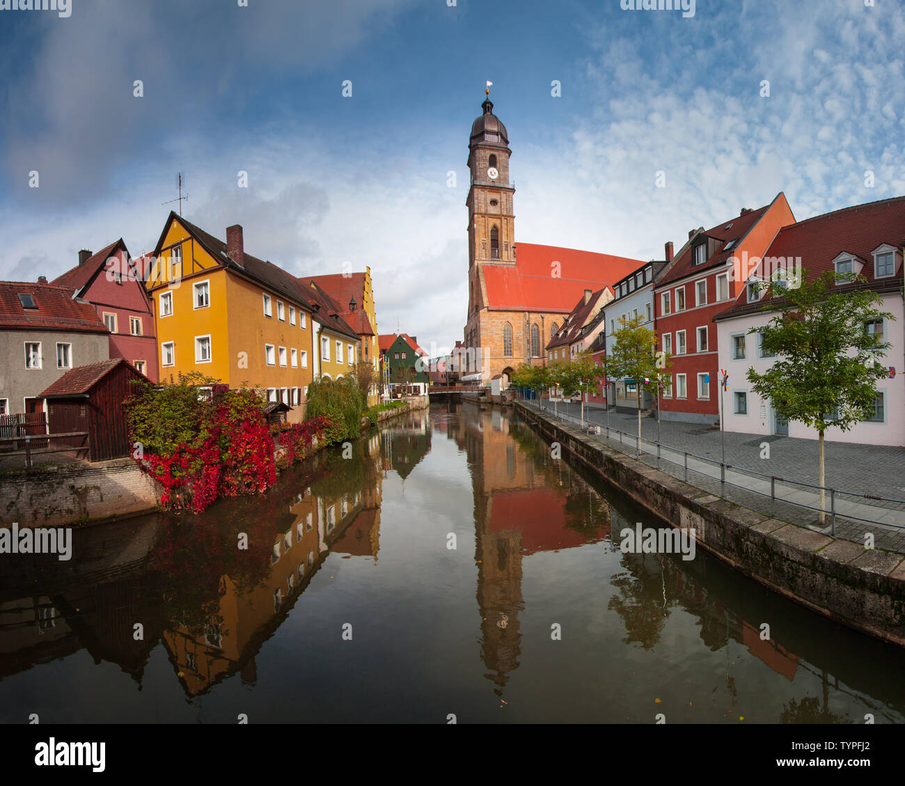 The reflection of Basilika St. Martin in Vils River, Amberg, Germany ...