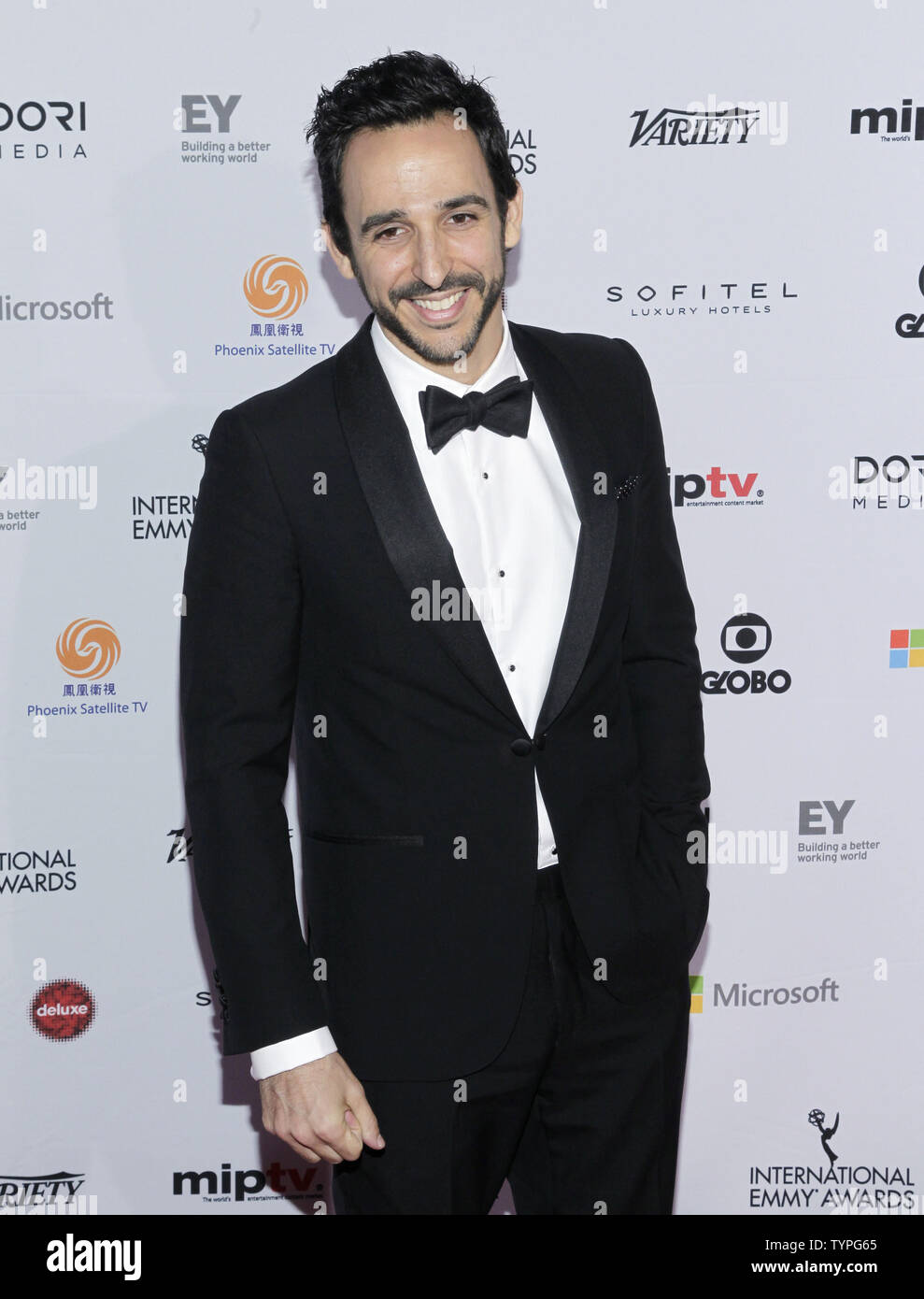 Amir Arison arrives on the red carpet at the 2014 International Academy ...