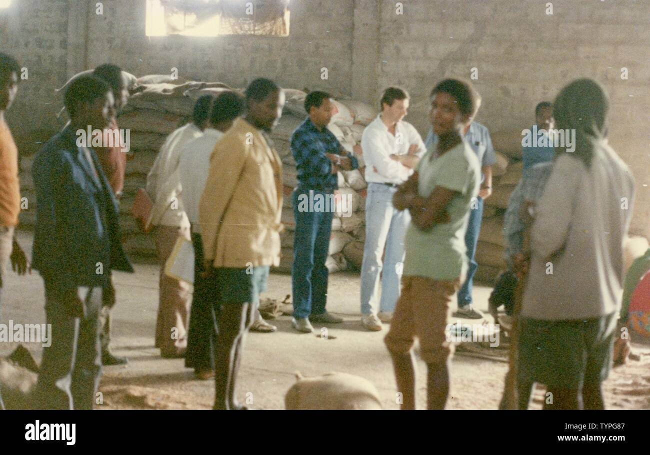 GROUP OF MEN STANDING/WAITING IN A FACTORY Stock Photo - Alamy