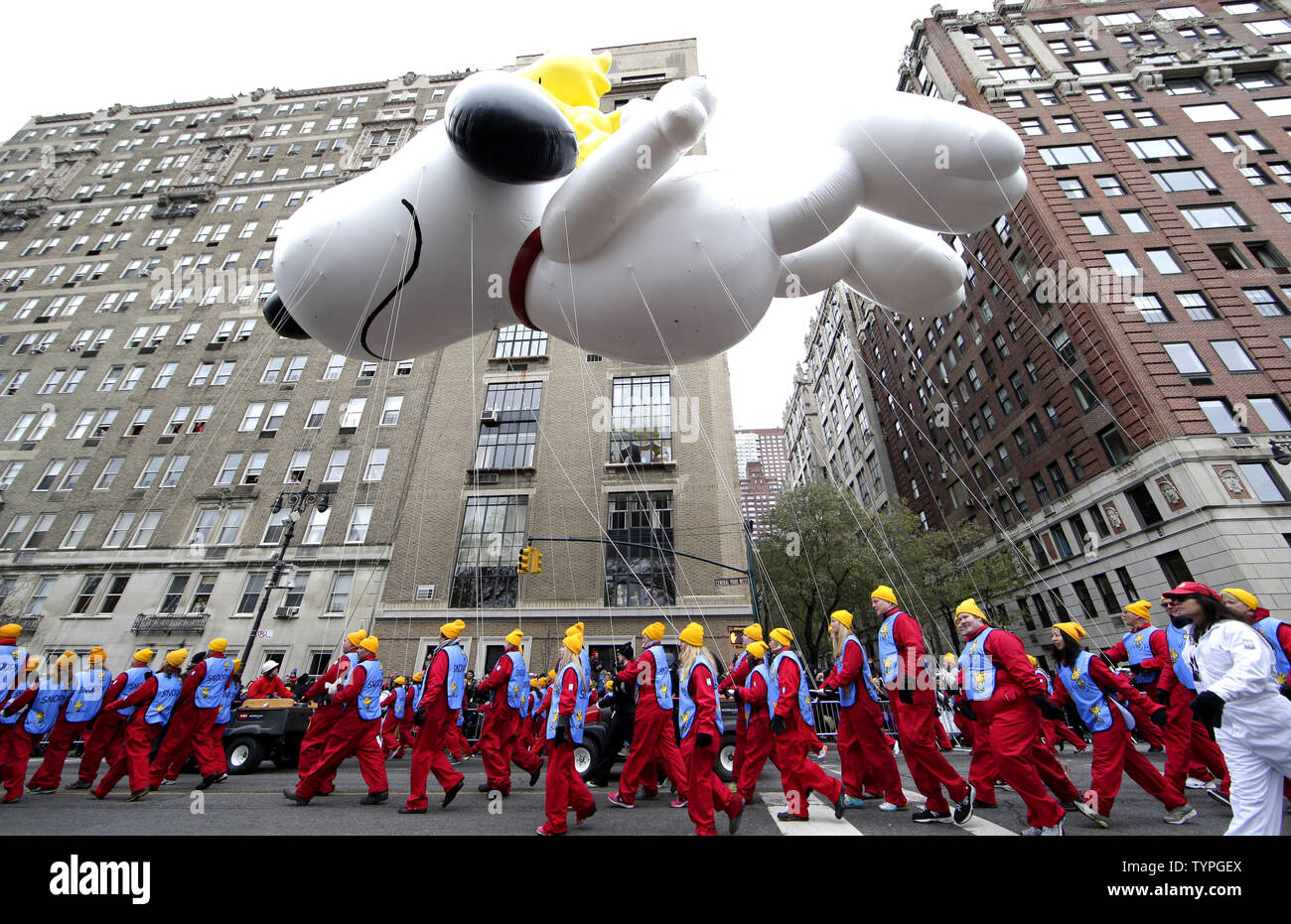 The giant Snoopy Balloon makes its way down the parade route at the ...