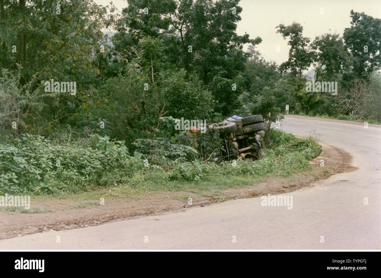 CARGO TRUCK OFF ROAD; TURNED OVER Stock Photo - Alamy