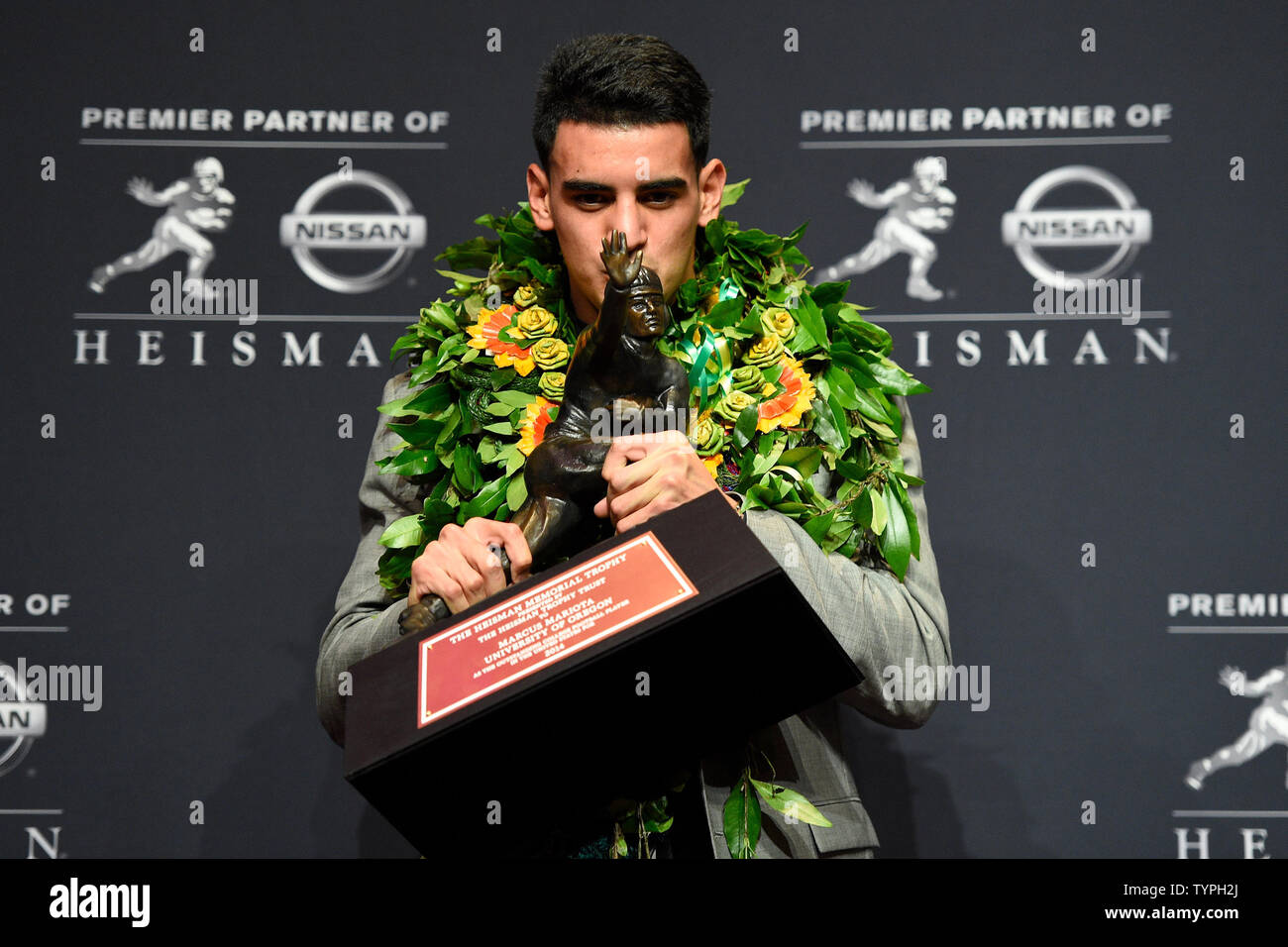 Oregon Ducks quarterback Marcus Mariota speaks to the media after ...