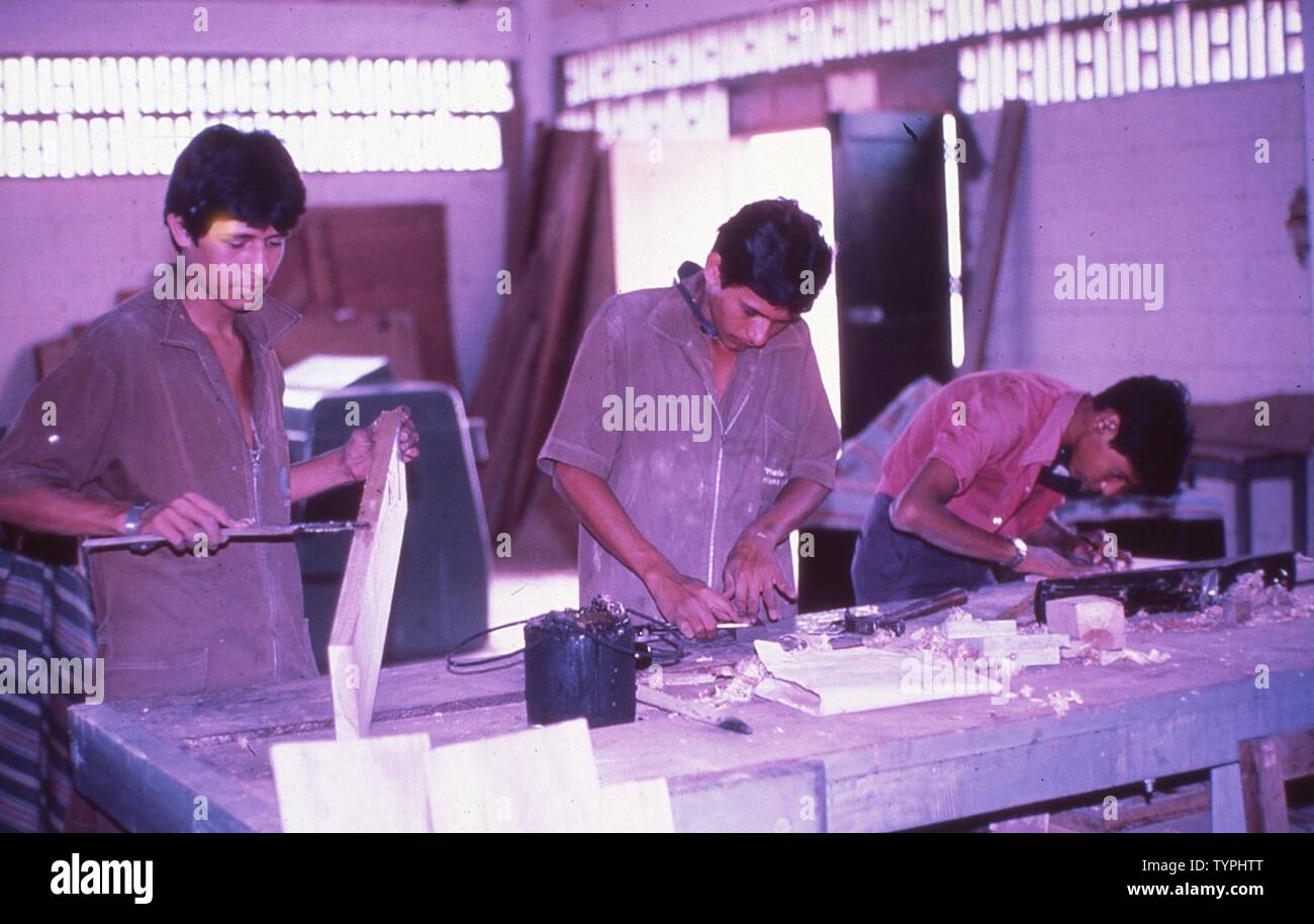 MEN CARVING WOOD Stock Photo - Alamy
