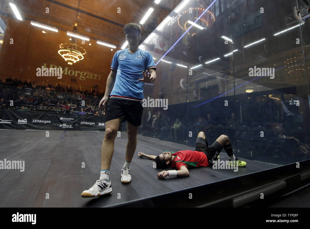 Chris Simpson of England walks by Cesar Salazar of Mexico who falls ...