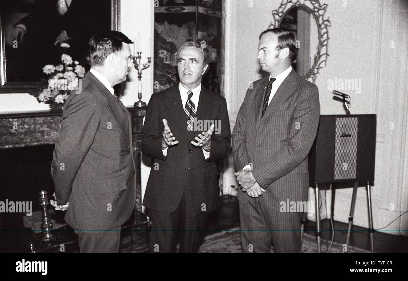 THREE MEN CONVERSING Stock Photo - Alamy