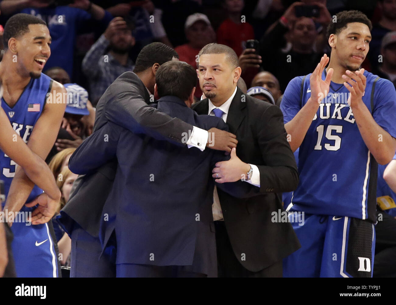 Duke Blue Devils coach Mike Krzyzewski celebrates with players and ...