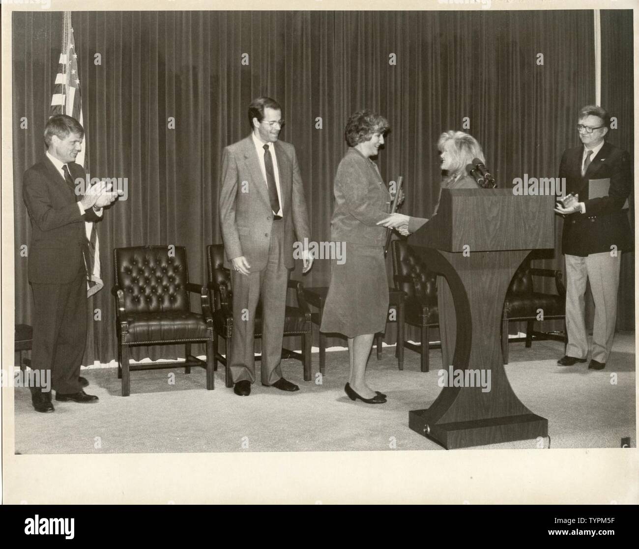 WOMEN SHAKING HANDS ON STAGE Stock Photo - Alamy