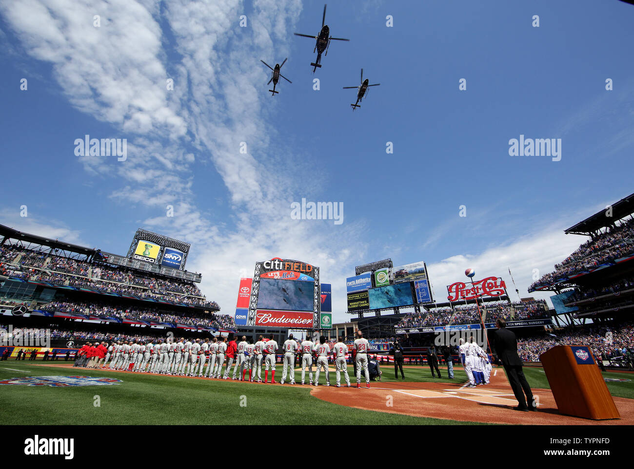 Three NYPD Helicopters fly over the field after the National Anthem ...