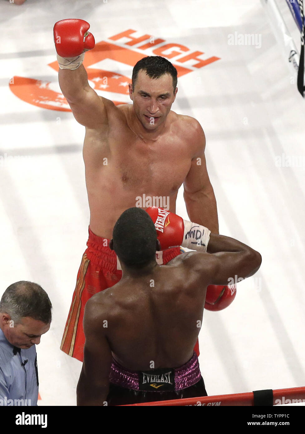 Wladimir Klitschko holds up one glove in front of Bryant Jennings after ...